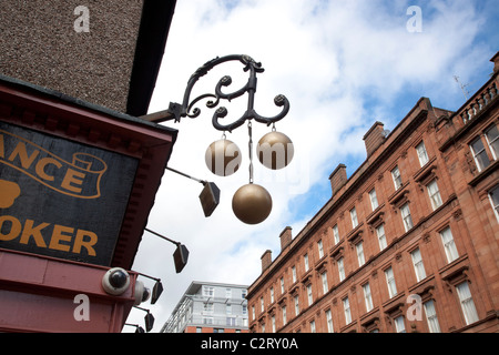 Three brass balls traditional sign of pawnbroker outside pawn shop St ...