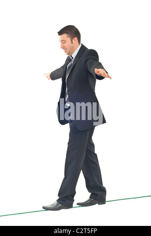 Young businessman balancing on tight rope controlled sketched by ...