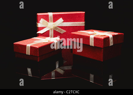 red gift boxes on black Stock Photo - Alamy