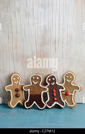 Gingerbread man cookies in a row isolated on white background, copy ...