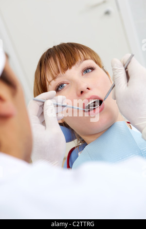 Close-up of open mouth during oral checkup at the dentist’s Stock Photo ...