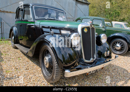 Morris 12 (centre) at a classic, vintage car show outdoors in the rain ...