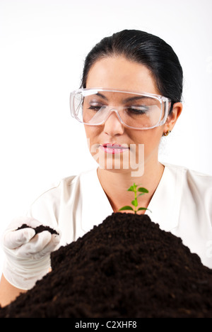 Soil test, female agricultural scientist conducting a soil test in a ...