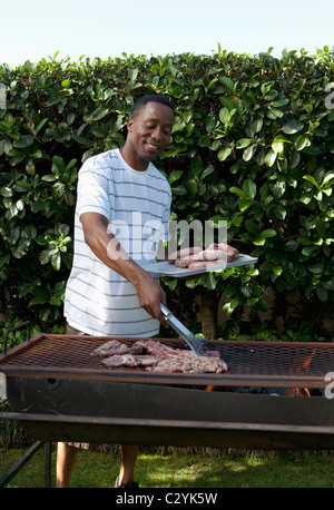 Man braaing in the garden, Johannesburg, South Africa Stock Photo - Alamy