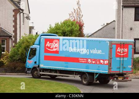 Argos home delivery van in a street with rear door open and man ...