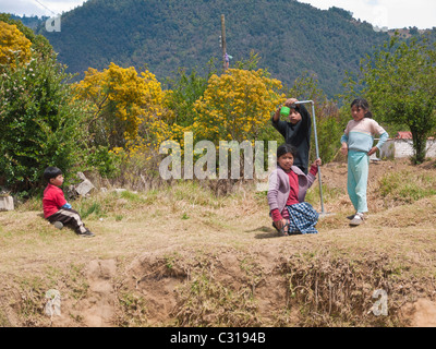 Four Guatemalan children play outside near their home in Totonicapan ...