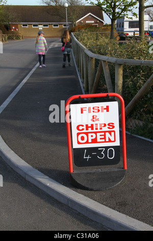 Fish and Chip shop sign open for business Stock Photo - Alamy