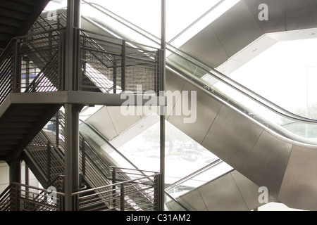 it is a modern escalator and a tradition stairs, made a composition ...