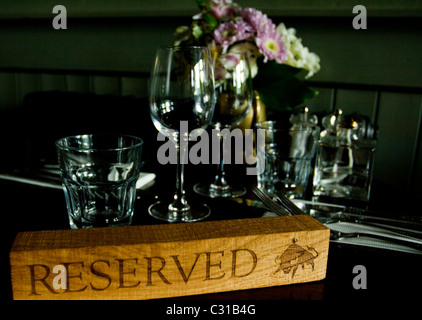 Reserved sign on a restaurant table Stock Photo - Alamy