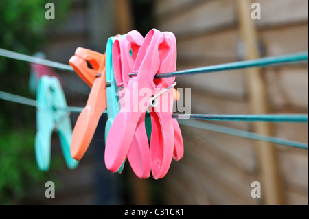 cloth pegs on washing line Stock Photo - Alamy