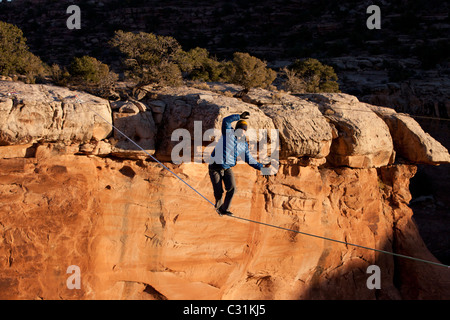A highliner walks across a long slackline, Moab, Utah Stock Photo - Alamy