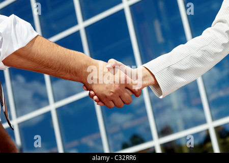 Image of business partners handshaking in office Stock Photo - Alamy