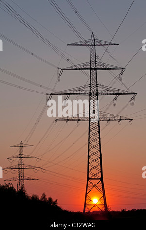 sunset behind pylons Stock Photo - Alamy