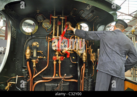 Steam locomotive footplate at STEAM Museum. NOTE figure is a model and ...