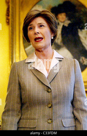 First lady Laura Bush unveils the new gold-rimmed set of official ...