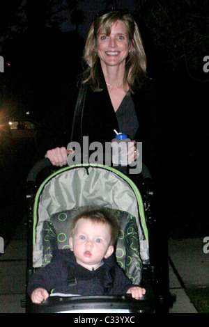 Courtney Thorne-Smith goes for a stroll with her son Jacob Fishman ...