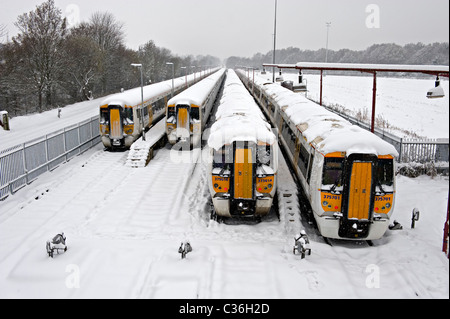 Snow Covered Railway Tracks and Stationary Trains Seen in Falling Snow ...