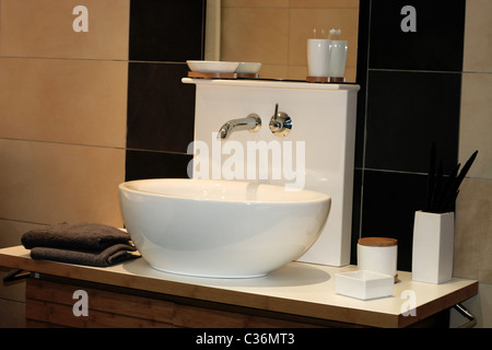 Front view of silver tap and white sink in a clean bathroom Stock Photo ...