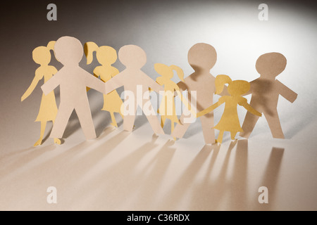 Paper Chain girls and boys, concept of Teamwork Stock Photo - Alamy