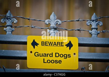 Beware Guard Dogs loose sign Stock Photo - Alamy
