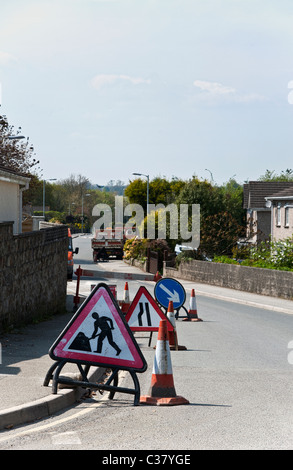 Series of road signs warning of road works, the narrowing of the ...