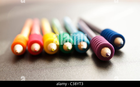 Multi-colored pencils on black background Stock Photo - Alamy