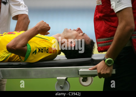 Injured football player being carried off the field by attendants from ...