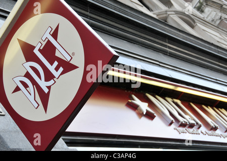 Pret a Manger - A sign and star logo outside a Pret a Manger coffee and ...