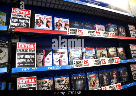 Shelf of DVD movies for rental inside a blockbuster store Stock Photo ...