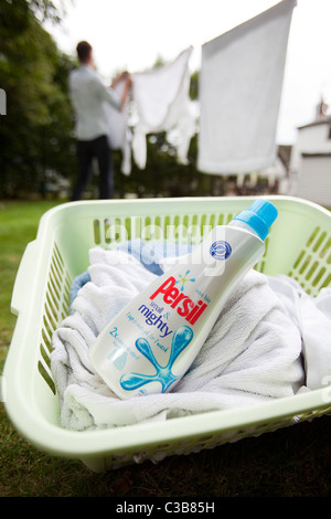 A young man hangs up his washing Stock Photo - Alamy