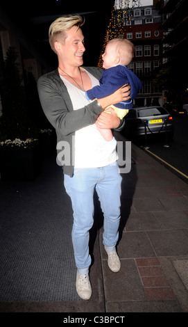 Lee Ryan holds his baby son, Rayn Amethyst Ryan, while out and about ...