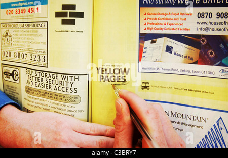 A man using the Yellow Pages telephone Directory Stock Photo - Alamy