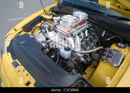 A large V8 car engine with shiny air intake trumpets Stock Photo - Alamy