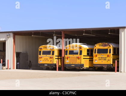 Buses in garage Stock Photo - Alamy