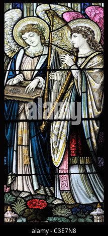 Stained glass window depicting two angels adoring the Eucharist. San ...