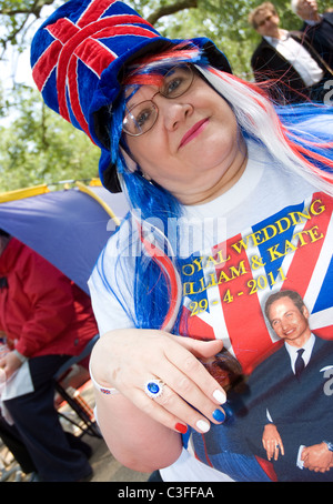 A royalist with a Union Jack painted on his face is strolling in front ...