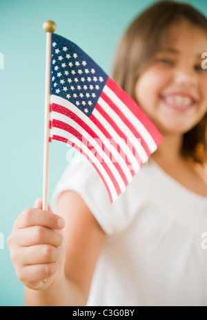 Brunette hispanic girl holding flag of United States of America ...