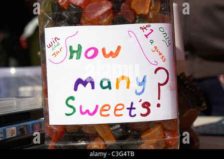 Guess how many sweets in the jar, school fete game Stock Photo - Alamy