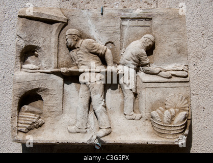 Stone carved sign in wall of Roman Baths in Bath England Stock Photo ...