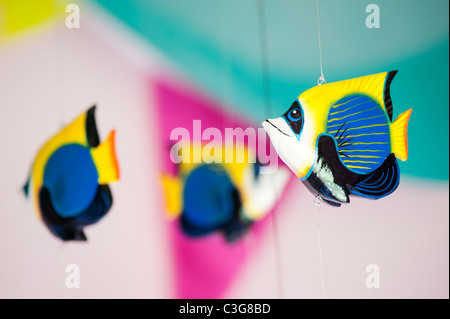 Colourful hanging wooden fish mobile. UK Stock Photo - Alamy