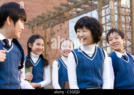 Five Chinese classmates talking in campus Stock Photo - Alamy