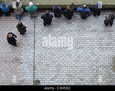 Construction workers watch people perform yoga on International Yoga ...