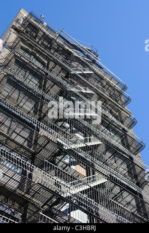 Fire escapes on tenement apartment buildings in Harlem neighborhood ...