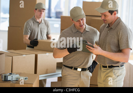 Warehouse worker checking order in engineering warehouse Stock Photo ...