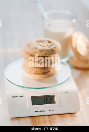 Scale and cookies Stock Photo - Alamy