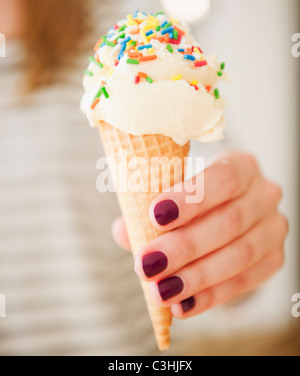 Female hand holding ice cream Stock Photo - Alamy