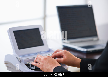 Court stenographer using stenograph machine Stock Photo - Alamy
