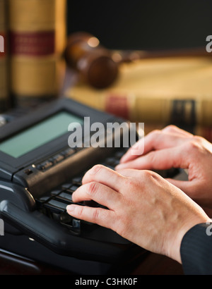 Court stenographer using stenograph machine Stock Photo - Alamy