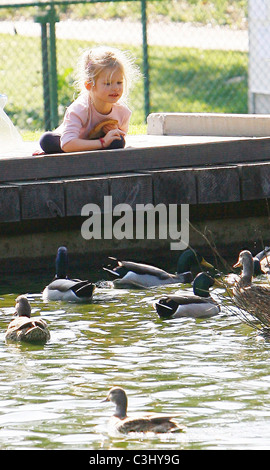 Violet Affleck feeding the ducks on a park pond in Brentwood Los ...