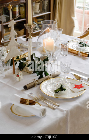 festive Christmas table place setting on wooden background with red ...